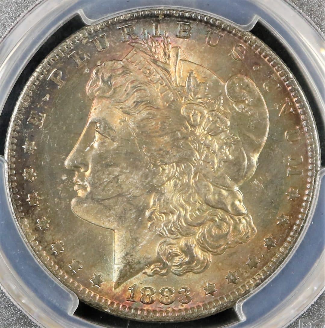 1883-O $1 Morgan Silver Dollar Rainbow Toning PCGS MS64 - Midwest Coin